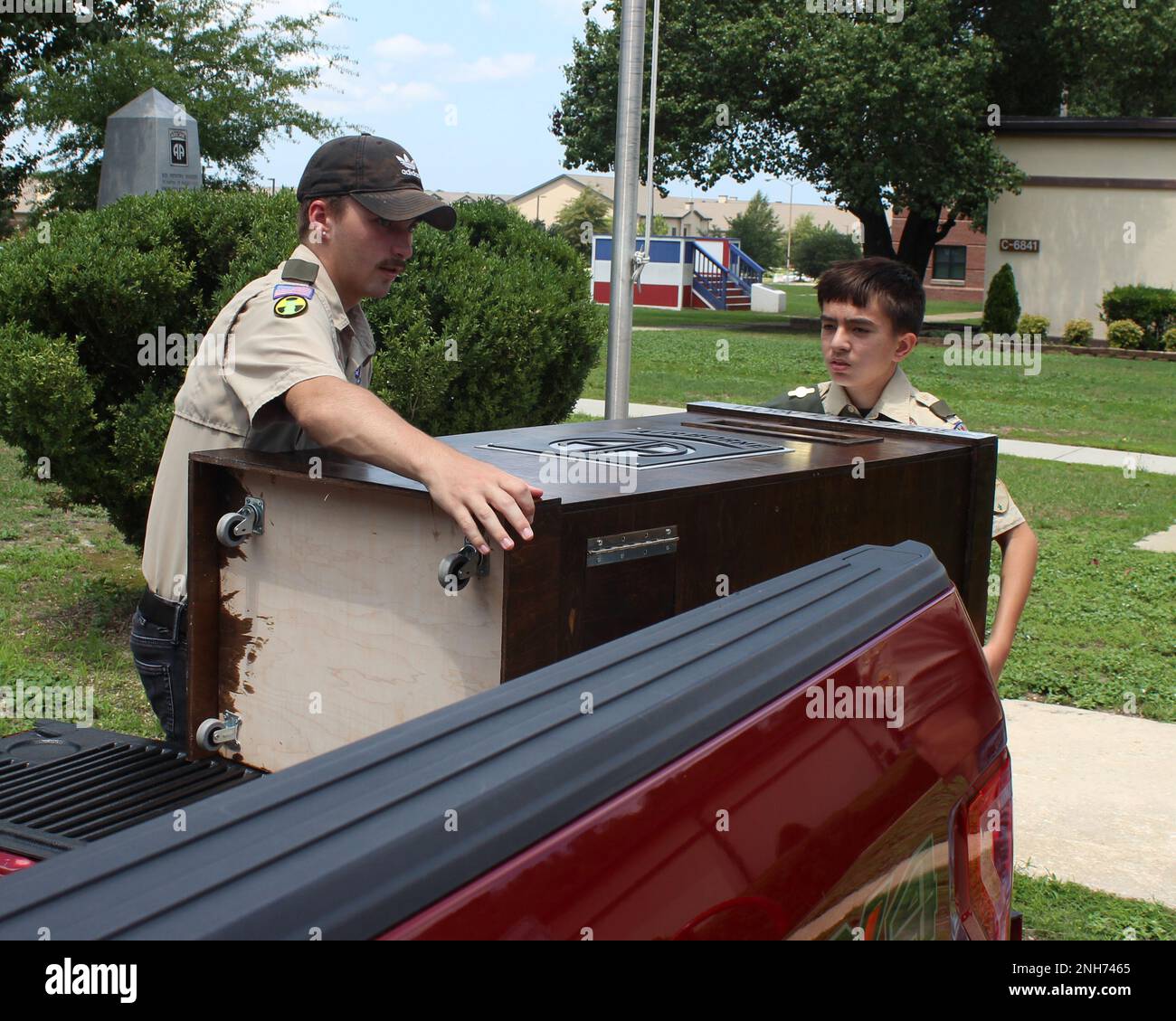 Riley Fitzwater, a scout in Troop 713, delivered a wooden receptacle ...