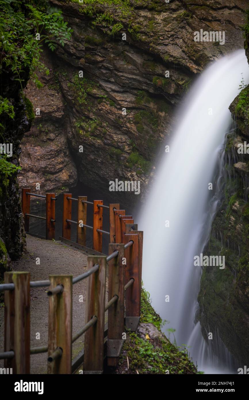 A built hiking trail leading to a waterfall Stock Photo - Alamy