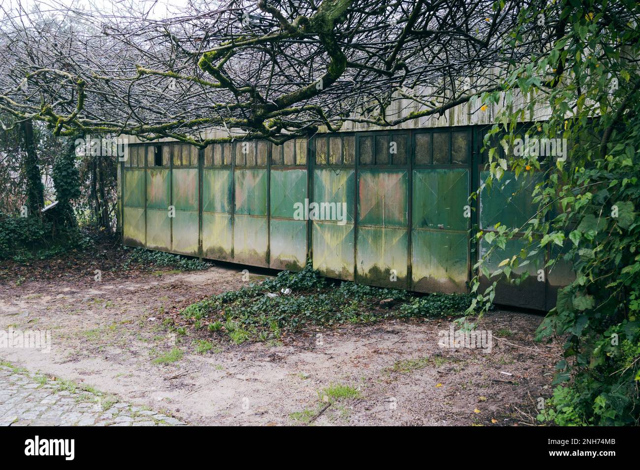 Big weathered gate at the majestic entrance to the closed territory ...