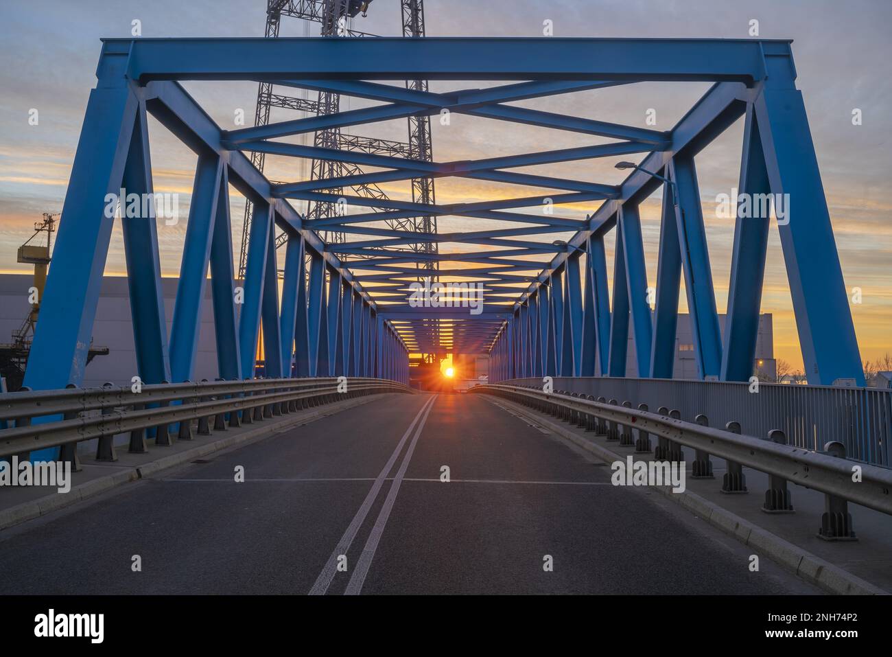rising sun over the truss bridge Stock Photo - Alamy
