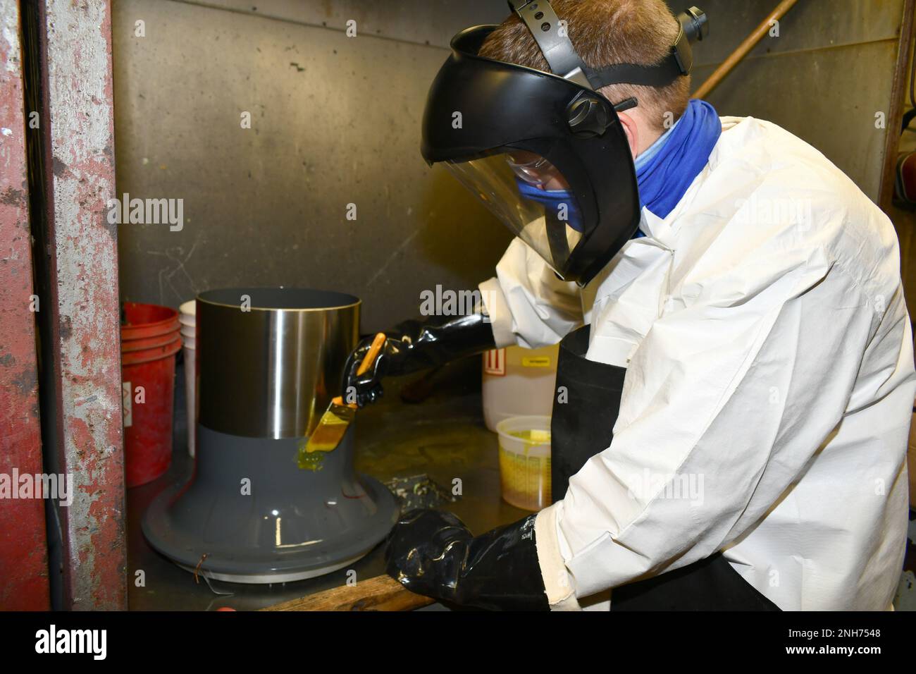 Corey Holstein, sandblaster in the small clean shop at FRCE, applies ...