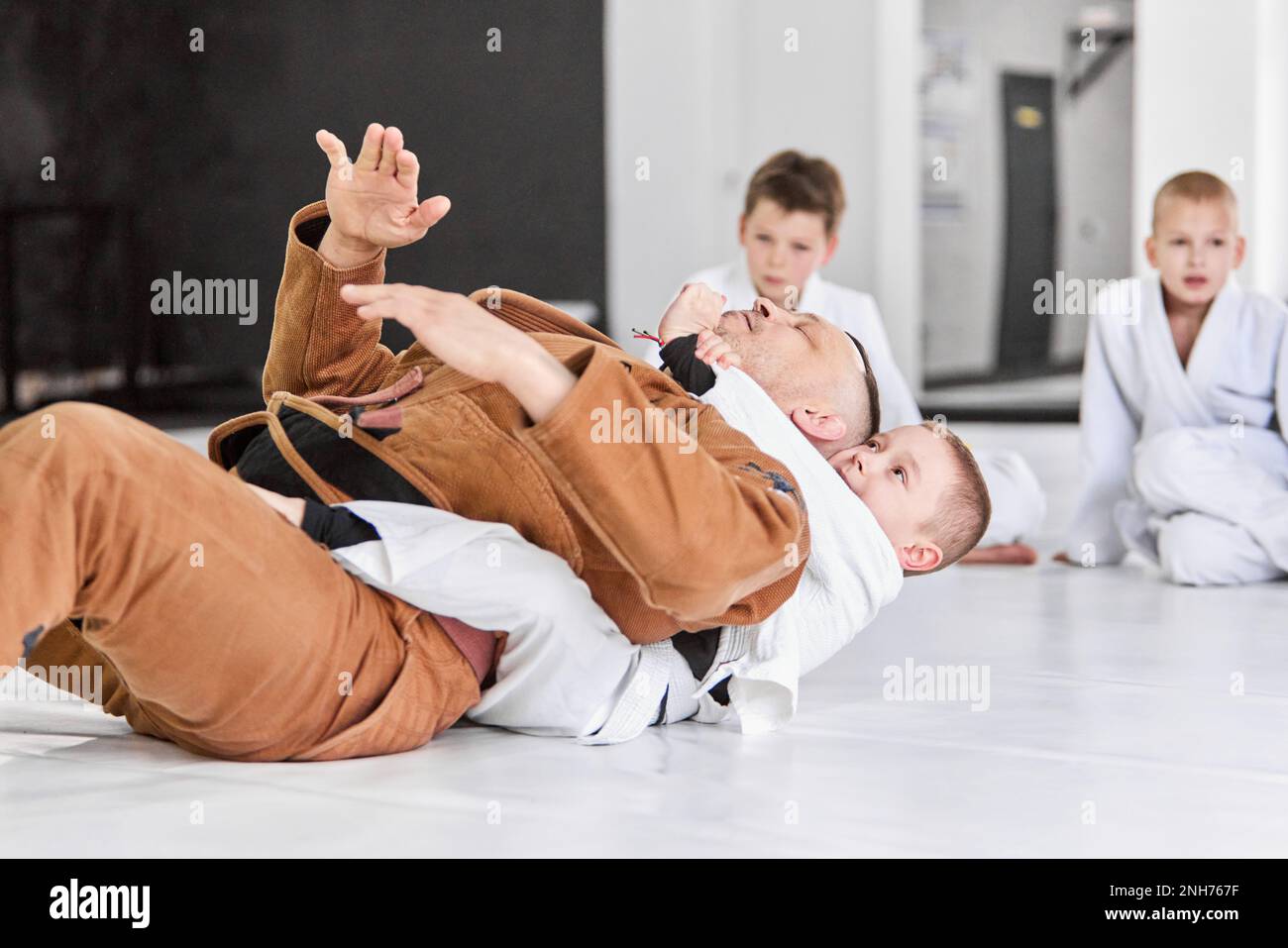 Dynamic portrait of man, professional judo, jiu-jitsu coach training ...