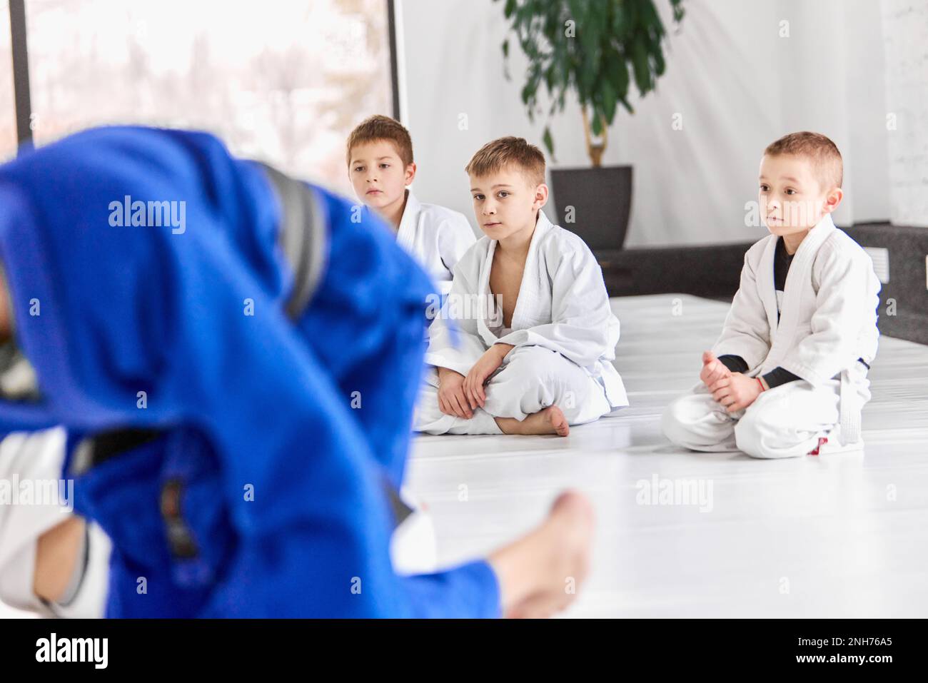 Boys, children in white kimono attending sport judo, jiu-jitsu class. Learning to fight Stock ...