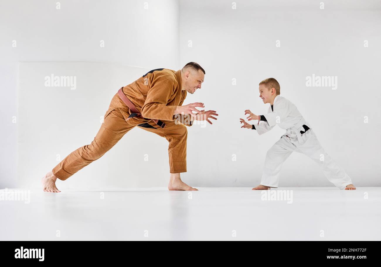 Dynamic portrait of man, professional judo, jiu-jitsu coach training ...