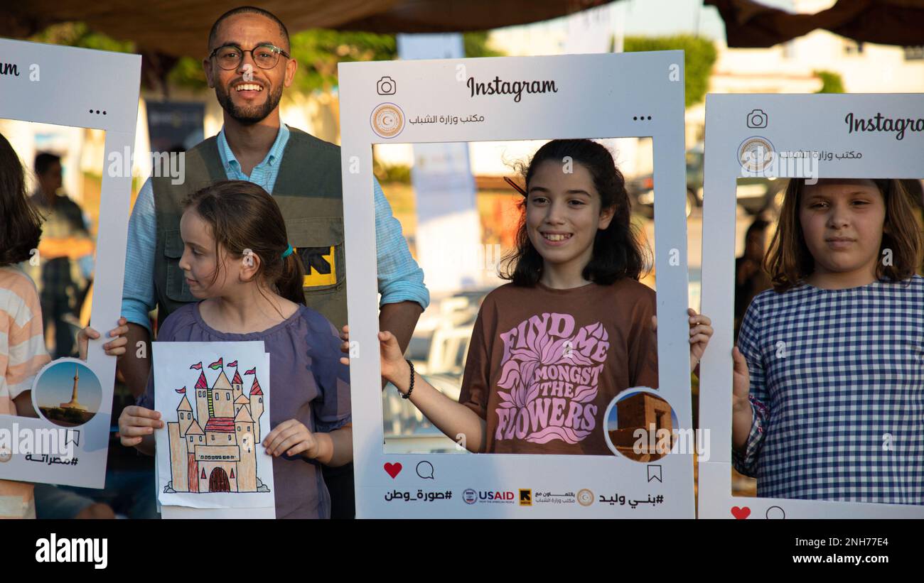 Participants take photos with special made selfie frames to celebrate ...