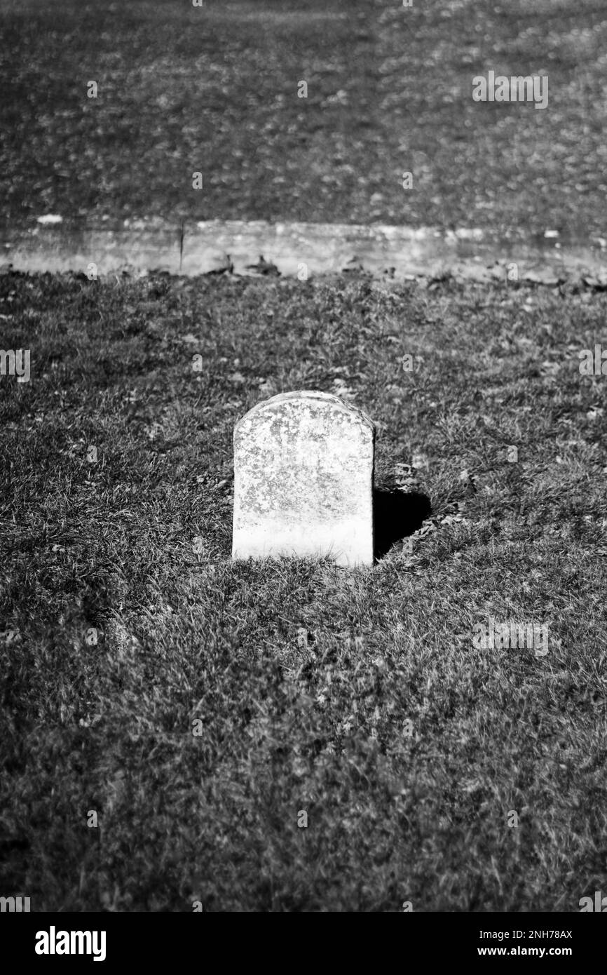 Typical common worn and weathered limestone tombstone with a blank ...