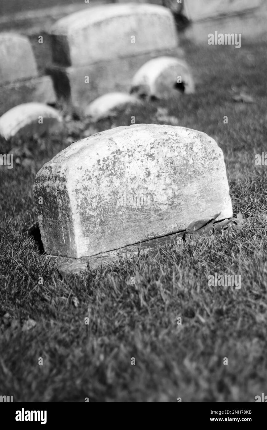Typical common worn and weathered limestone tombstone with a blank ...