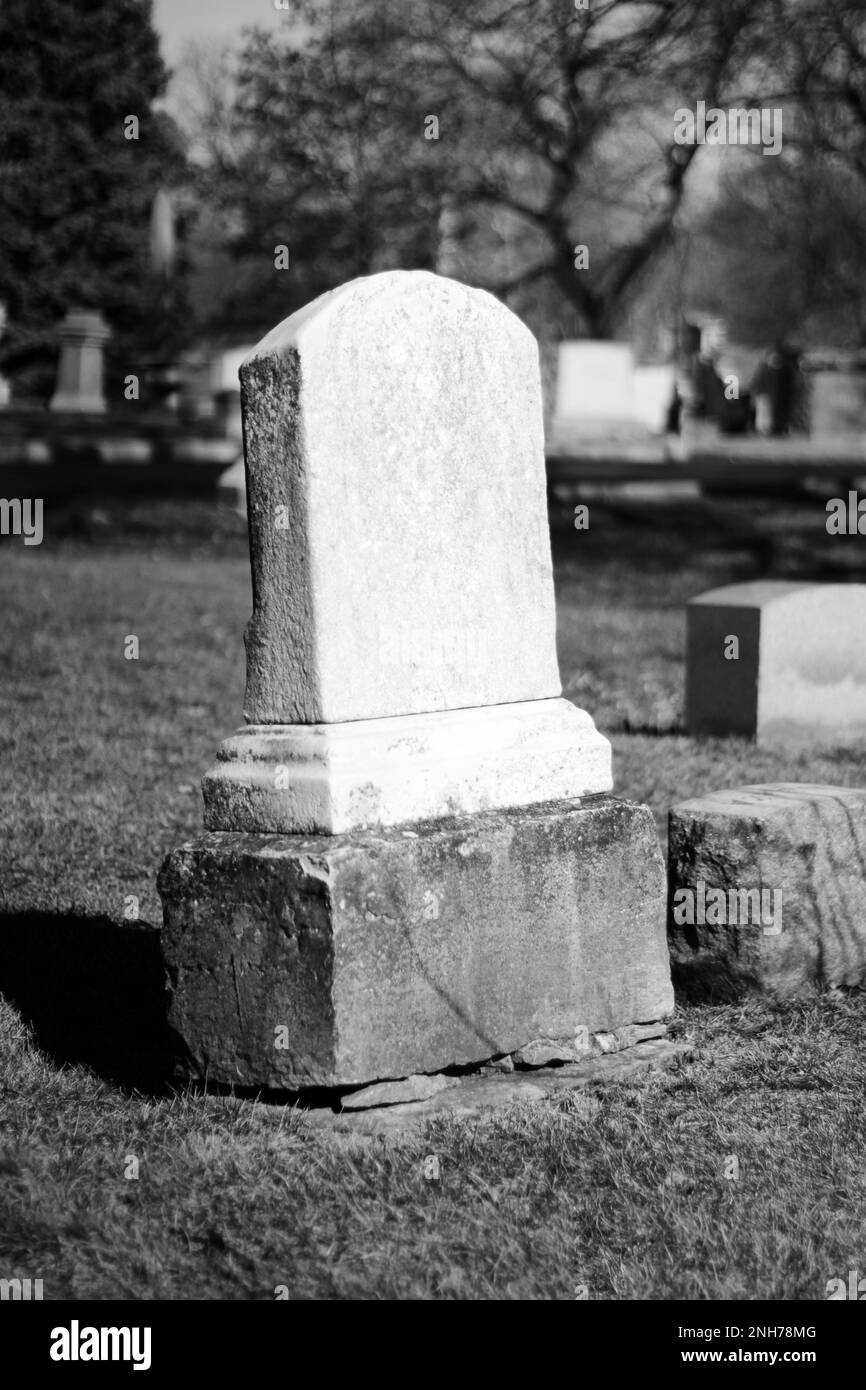 Typical common worn and weathered limestone tombstone with a blank ...