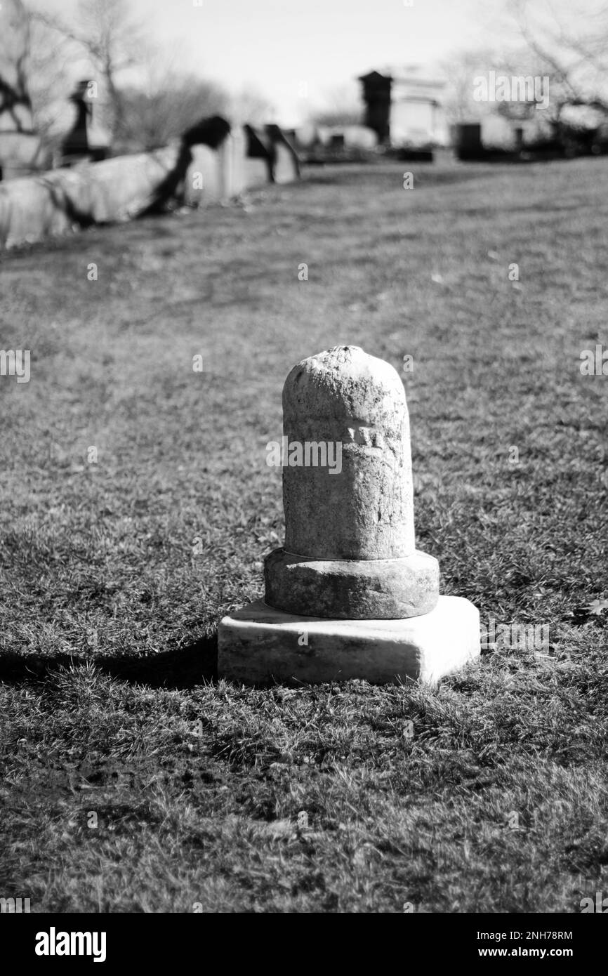 Typical common worn and weathered limestone tombstone with a blank ...