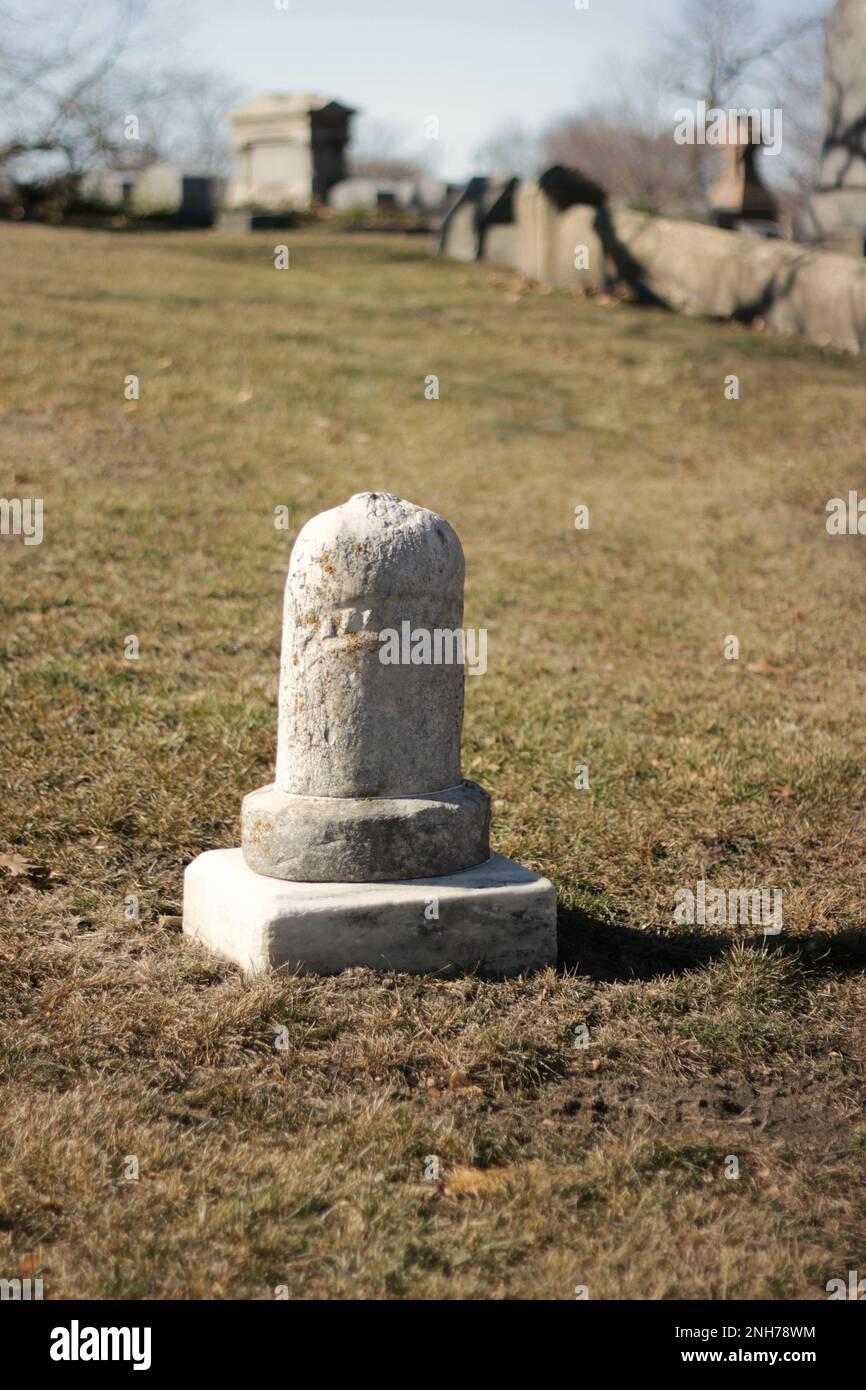 Typical common worn and weathered limestone tombstone with a blank ...