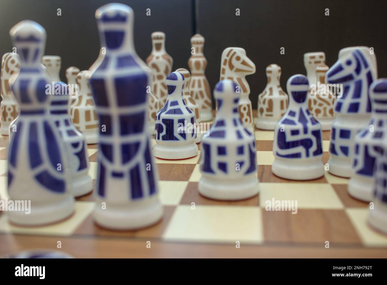 some blue and brown pieces of chess on the chessboard Stock Photo - Alamy