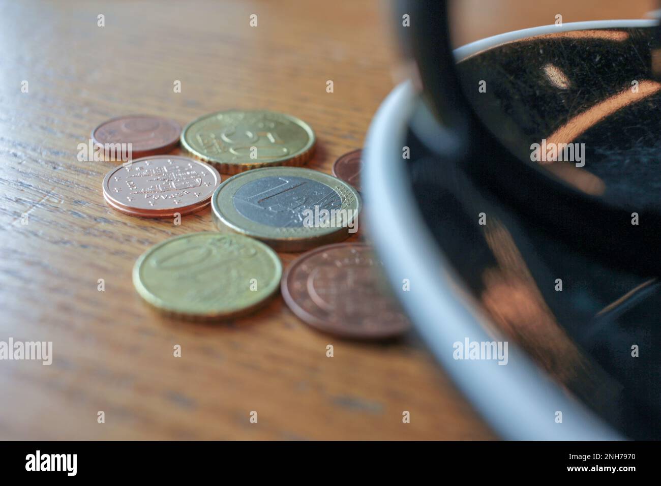 coins to pay for coffee in a cafeteria Stock Photo - Alamy