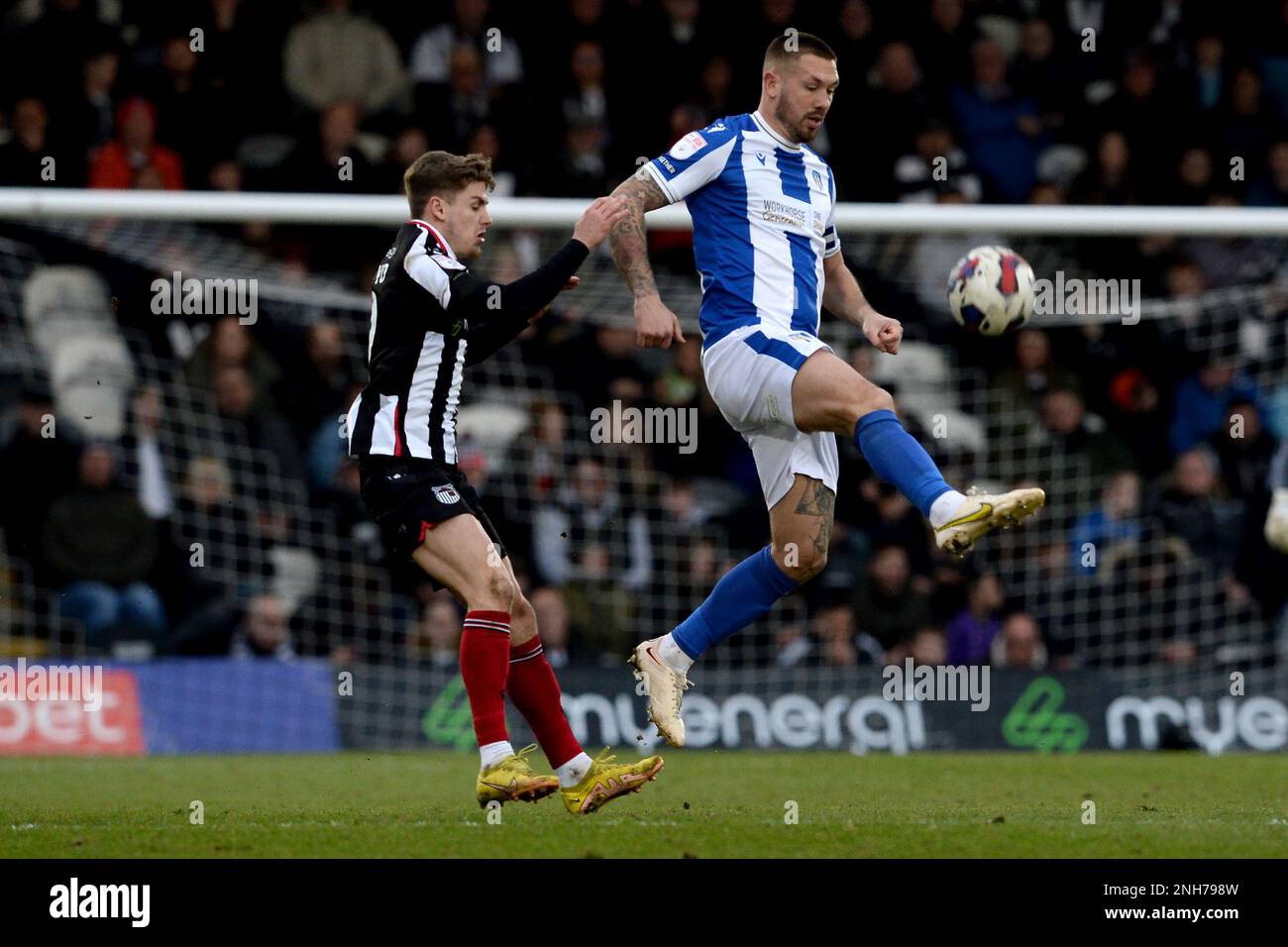 Luke Chambers of Colchester United does battle with George Lloyd of ...