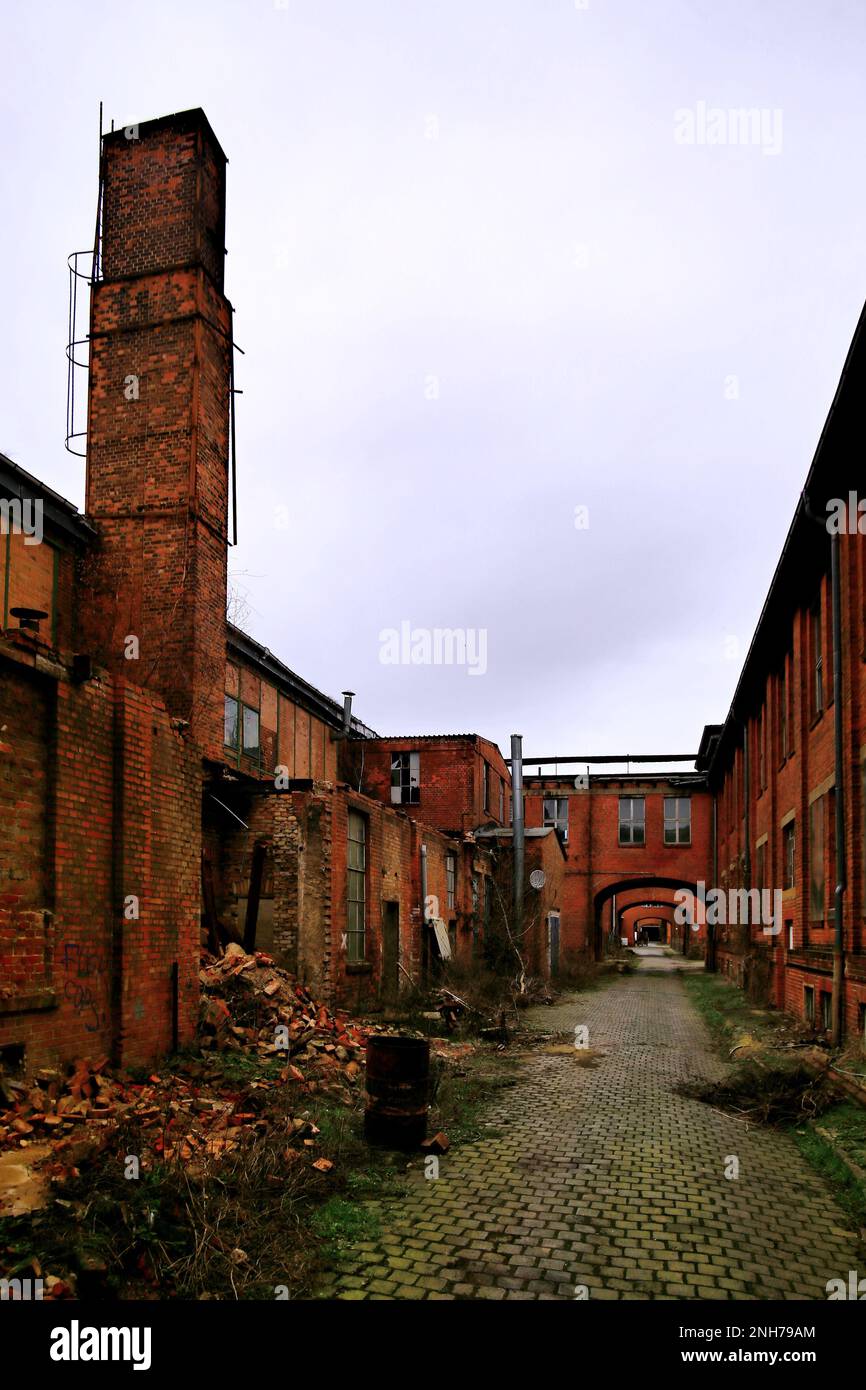 Derelict street on an abandoned industrial site in Magdeburg, Germany ...