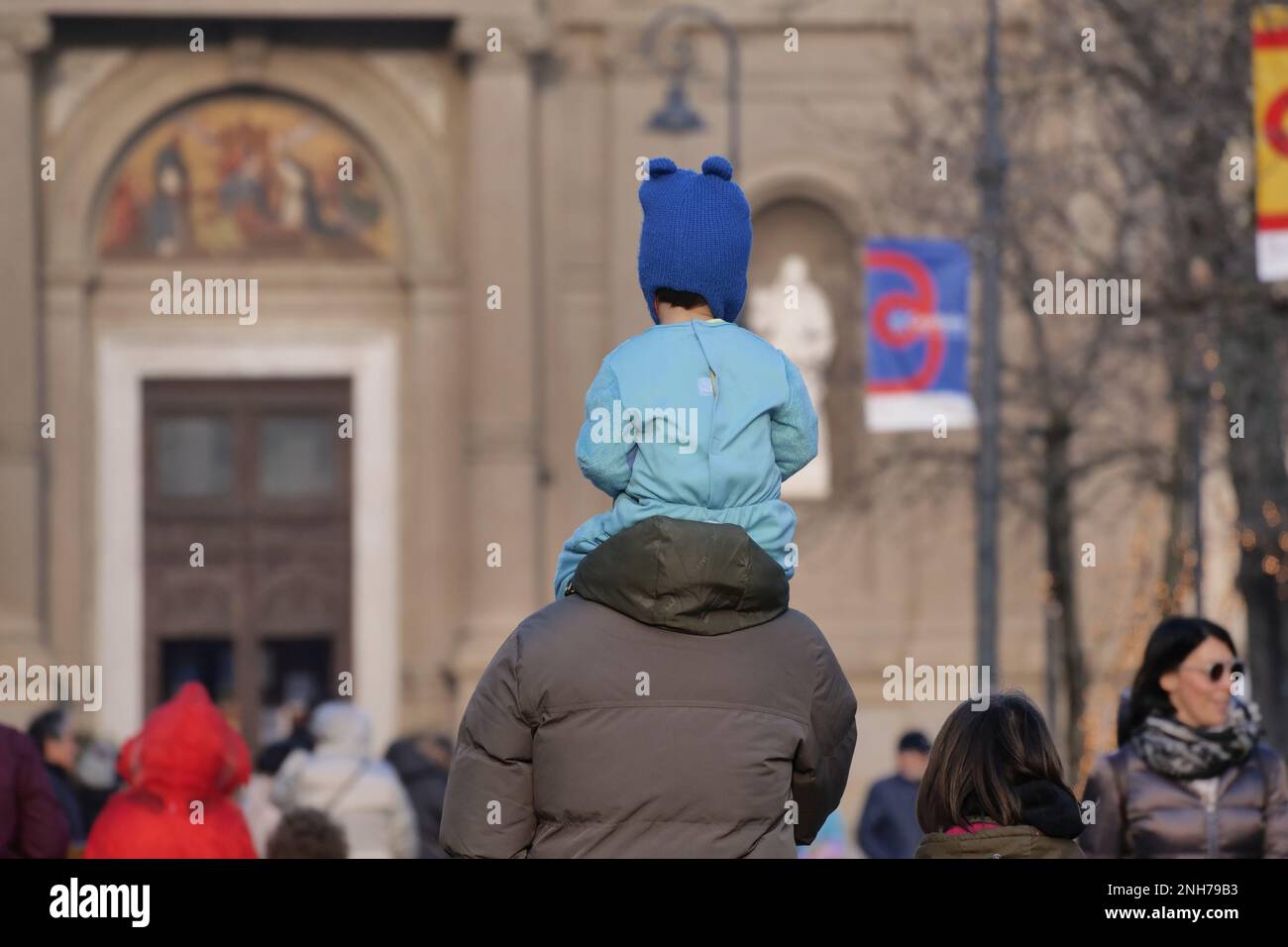 Child in carnival outifts play with confetti and streamers in the ...