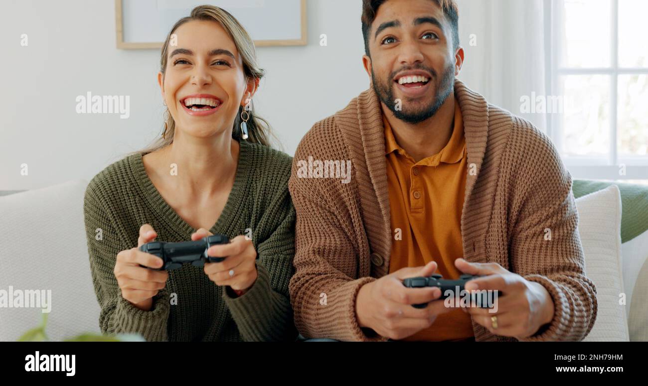 Fun, playing and love with a gamer couple laughing, joking or bonding ...