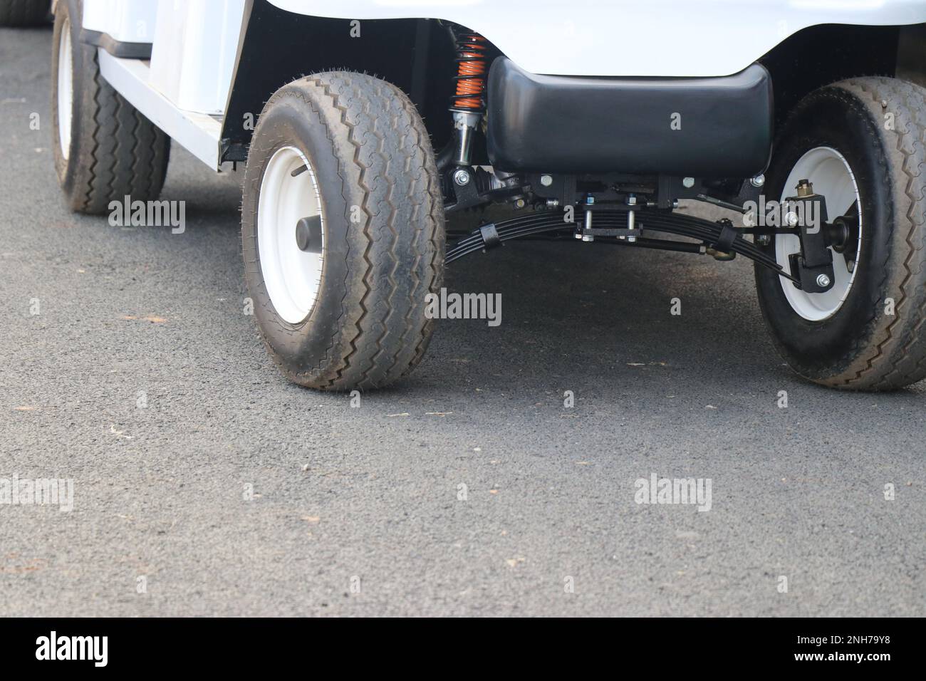 View of Wheels and suspension of a golf cart or electric carts used for ...
