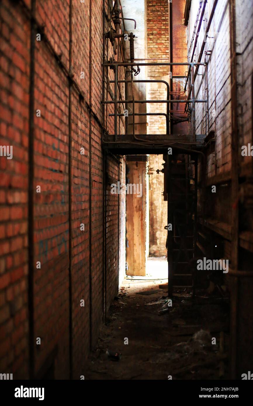Small corridor between furnaces in an abandoned power house Stock Photo ...