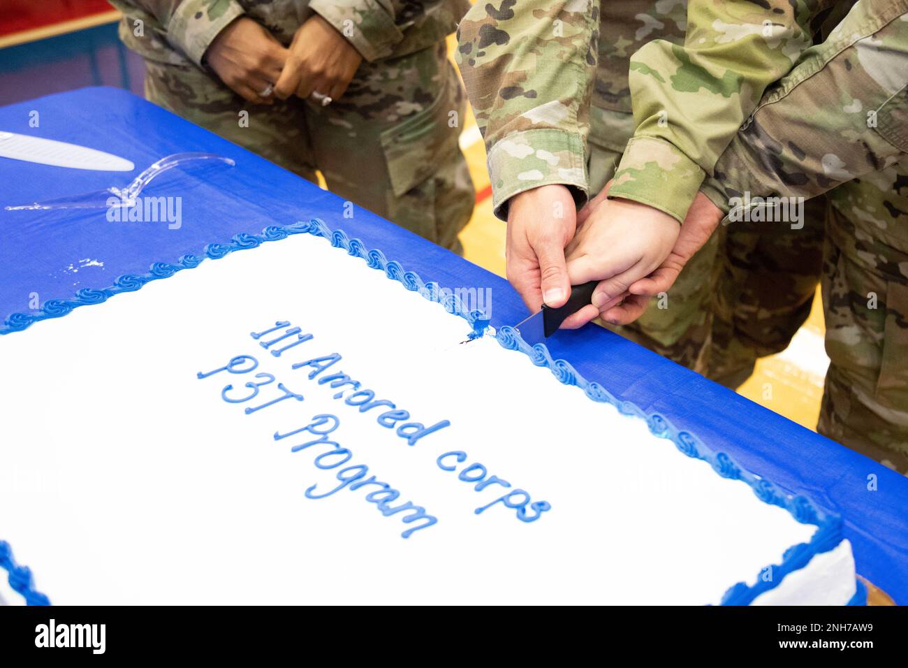 III Armored Corps leaders gather to cut the cake during a celebration ...