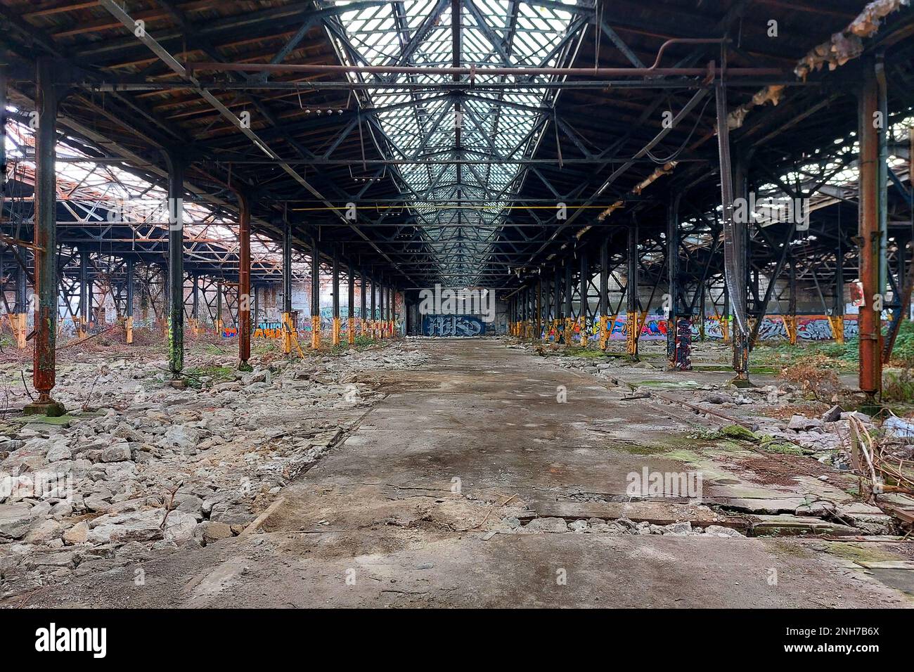 Huge abandoned factory with damaged concrete ground Stock Photo - Alamy