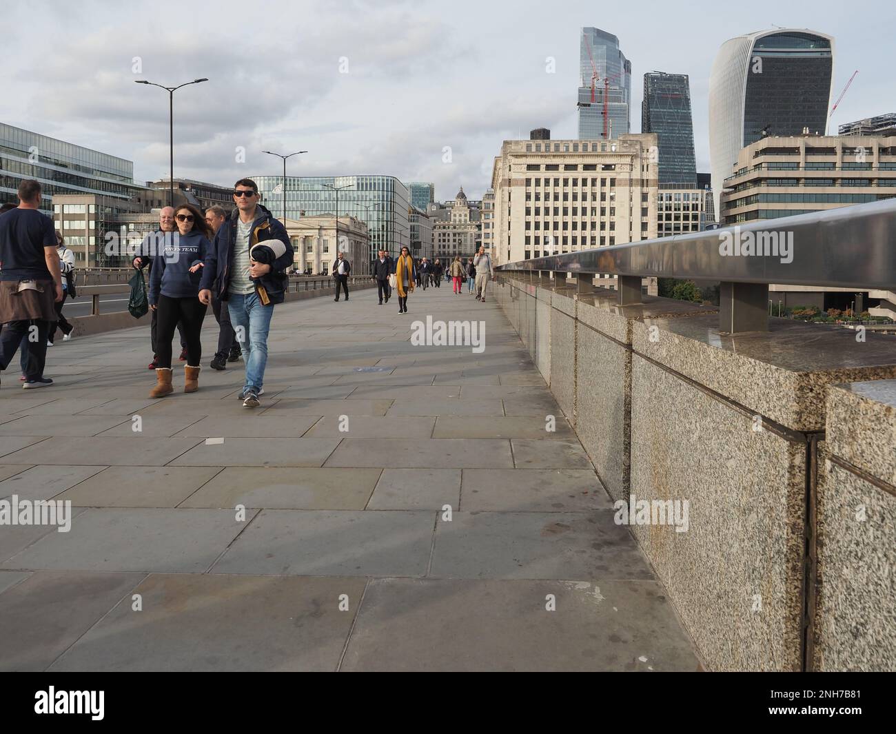 LONDON, UK - CIRCA OCTOBER 2022: People crossing London Bridge over ...