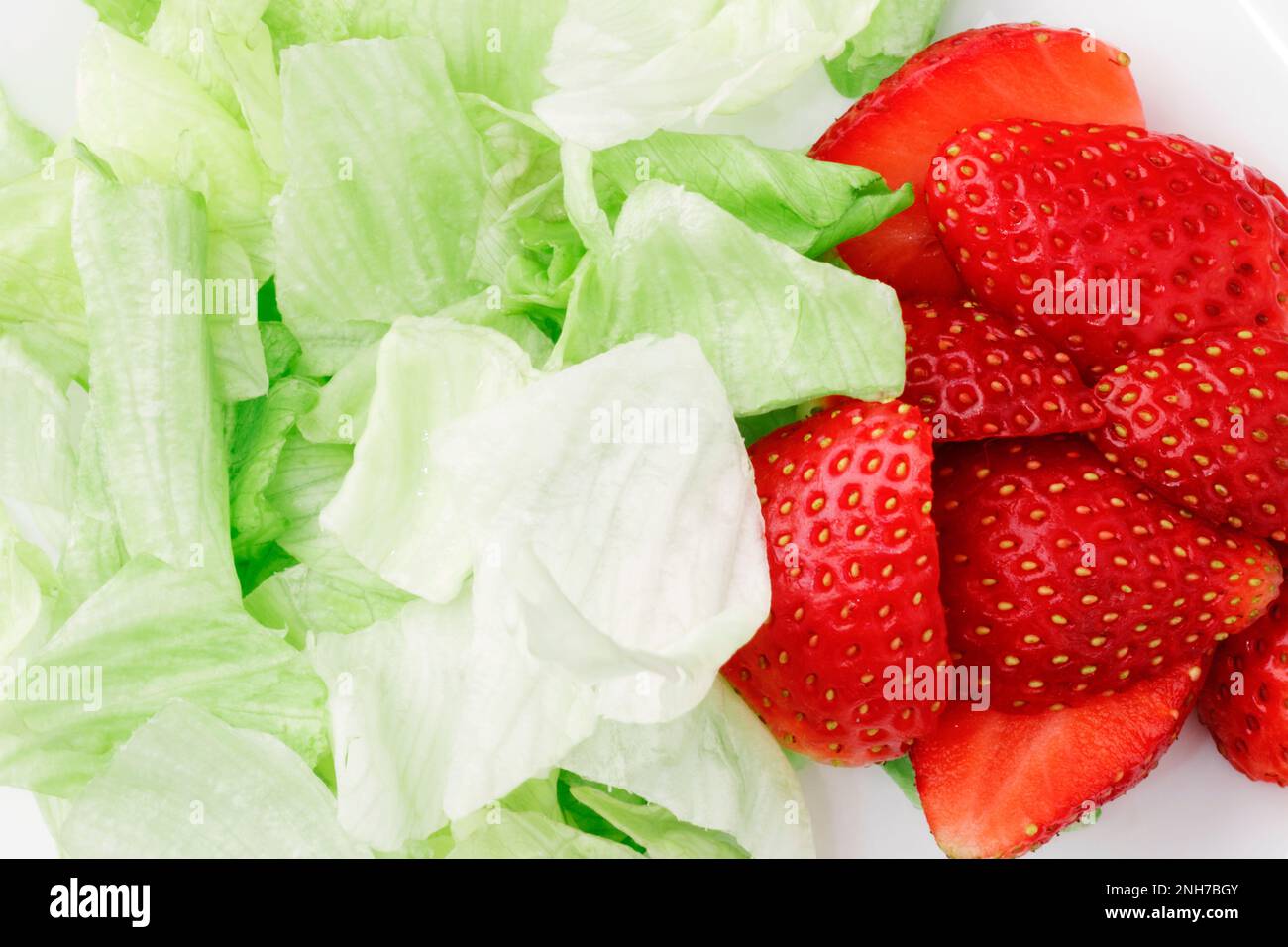 Healthy summer diet salad with strawberries and leaves iceberg lettuce ...