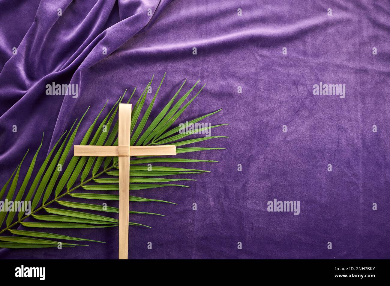 Lent season, Holy week and Good friday concept. Palm leave and cross on ...