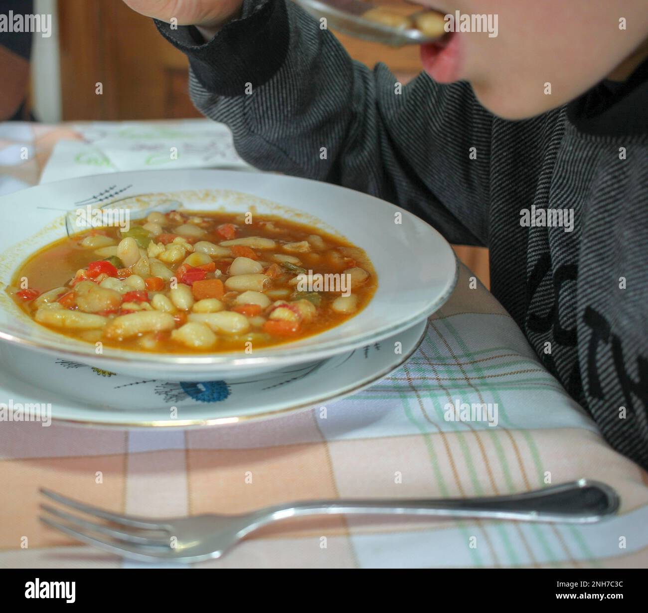 Boy eating beans hi-res stock photography and images - Alamy