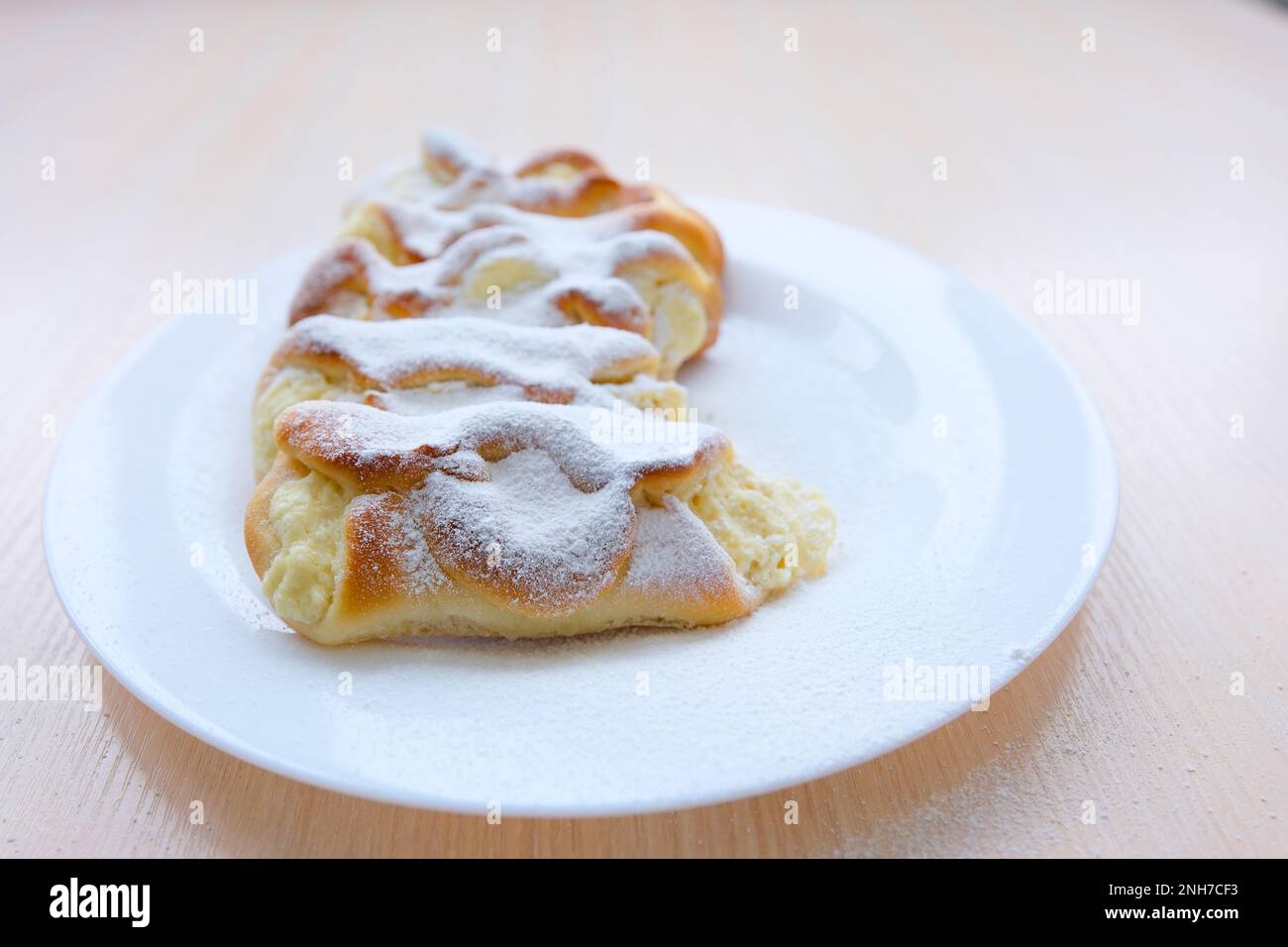 on rectangular white porcelain plate slowly sprinkle cottage cheese ...