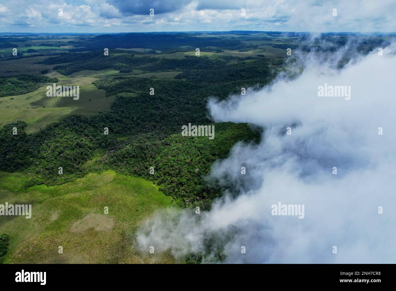 An aerial view of a landscape with clouds hovering over Stock Photo - Alamy