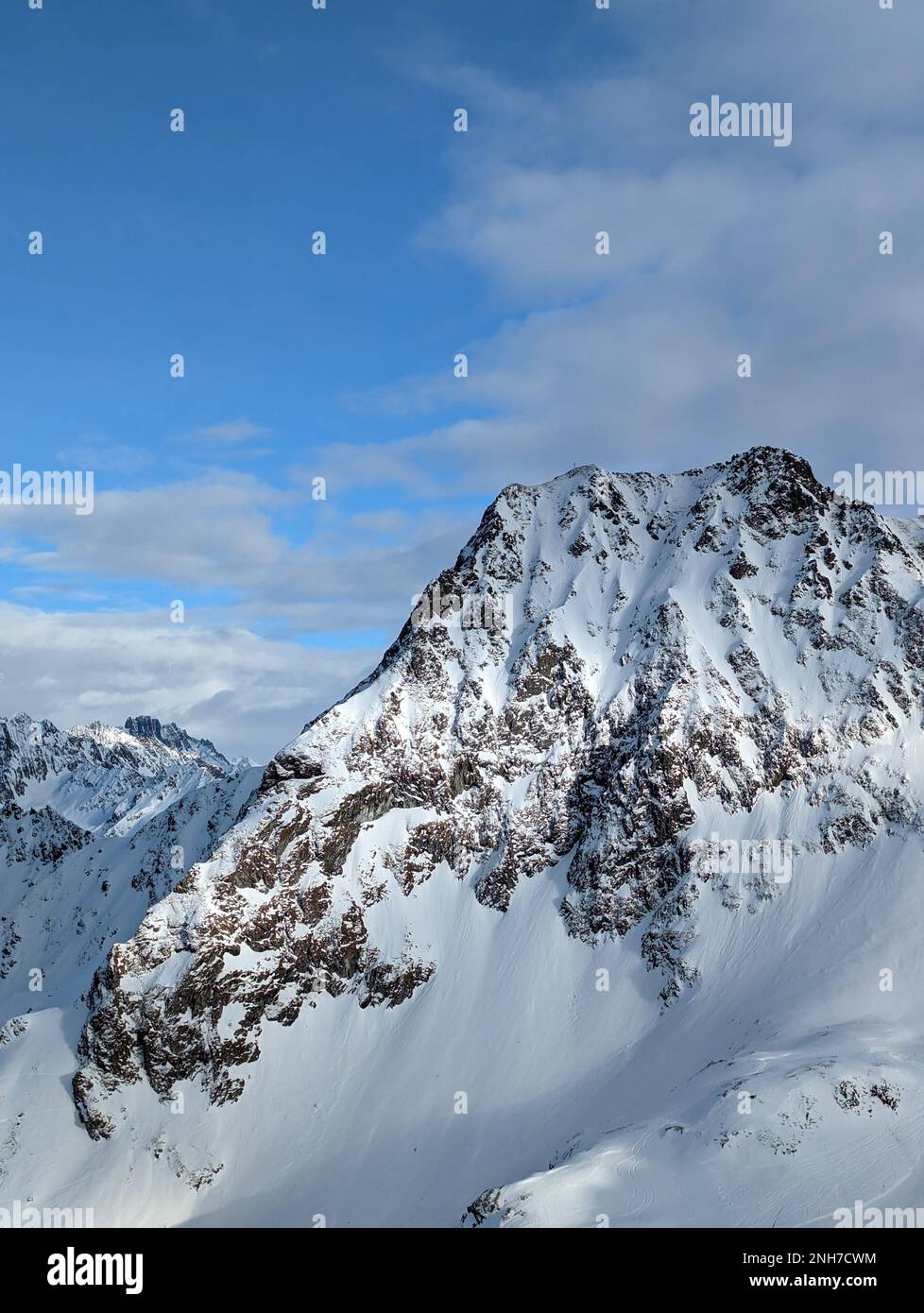 A Scenic view of a snow covered mountain peak Stock Photo - Alamy