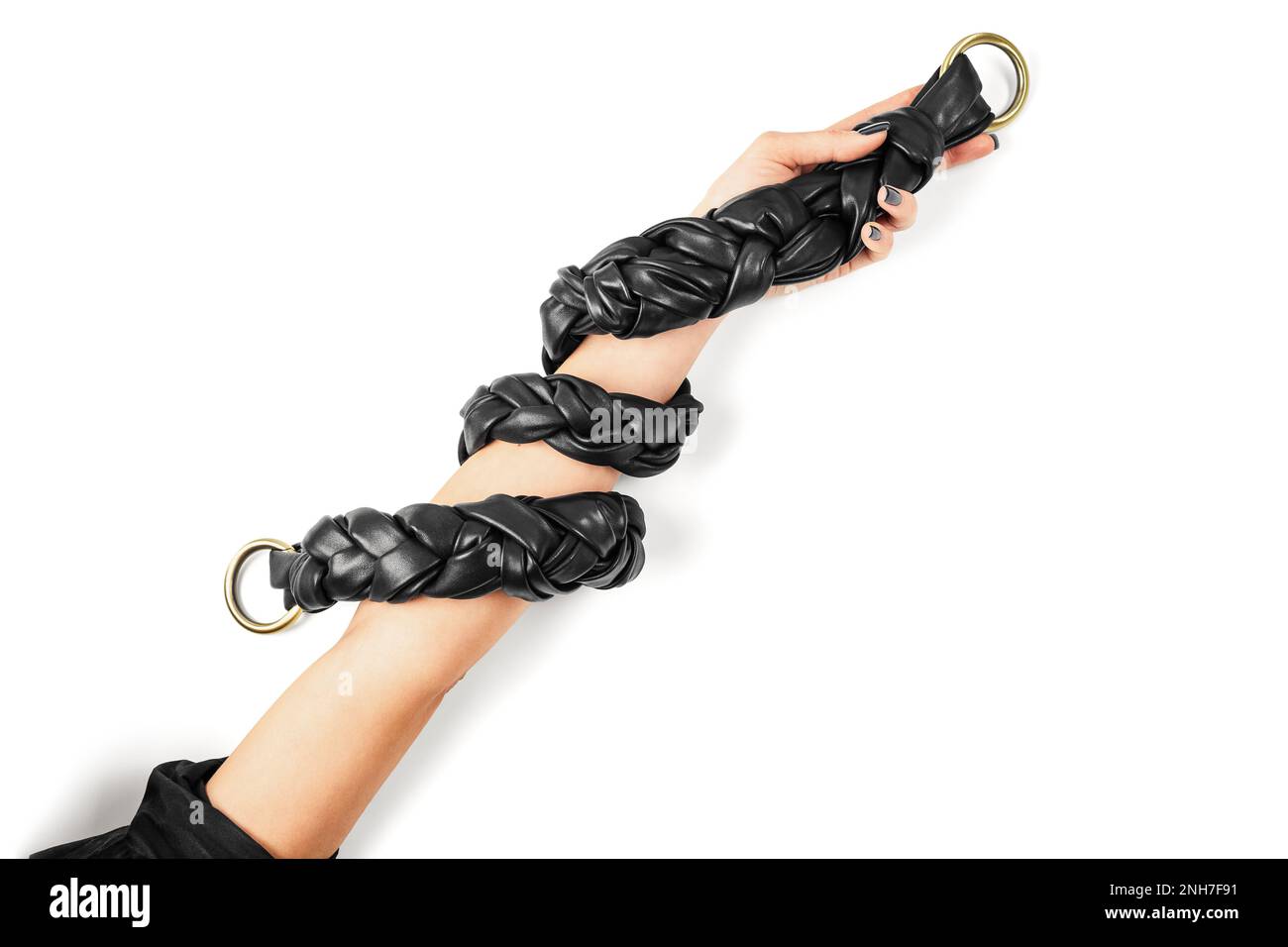 Black Genuine Leather Braided Shoulder Bag Strap Wrapped around Female Arm Isolated on White ...