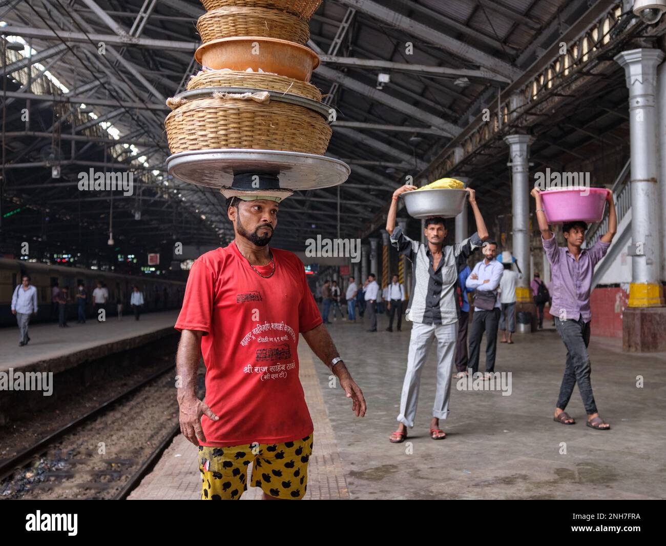 Porters at Chhatrapati Shivaji Maharaj Terminus (CSMT) in Mumbai, India ...