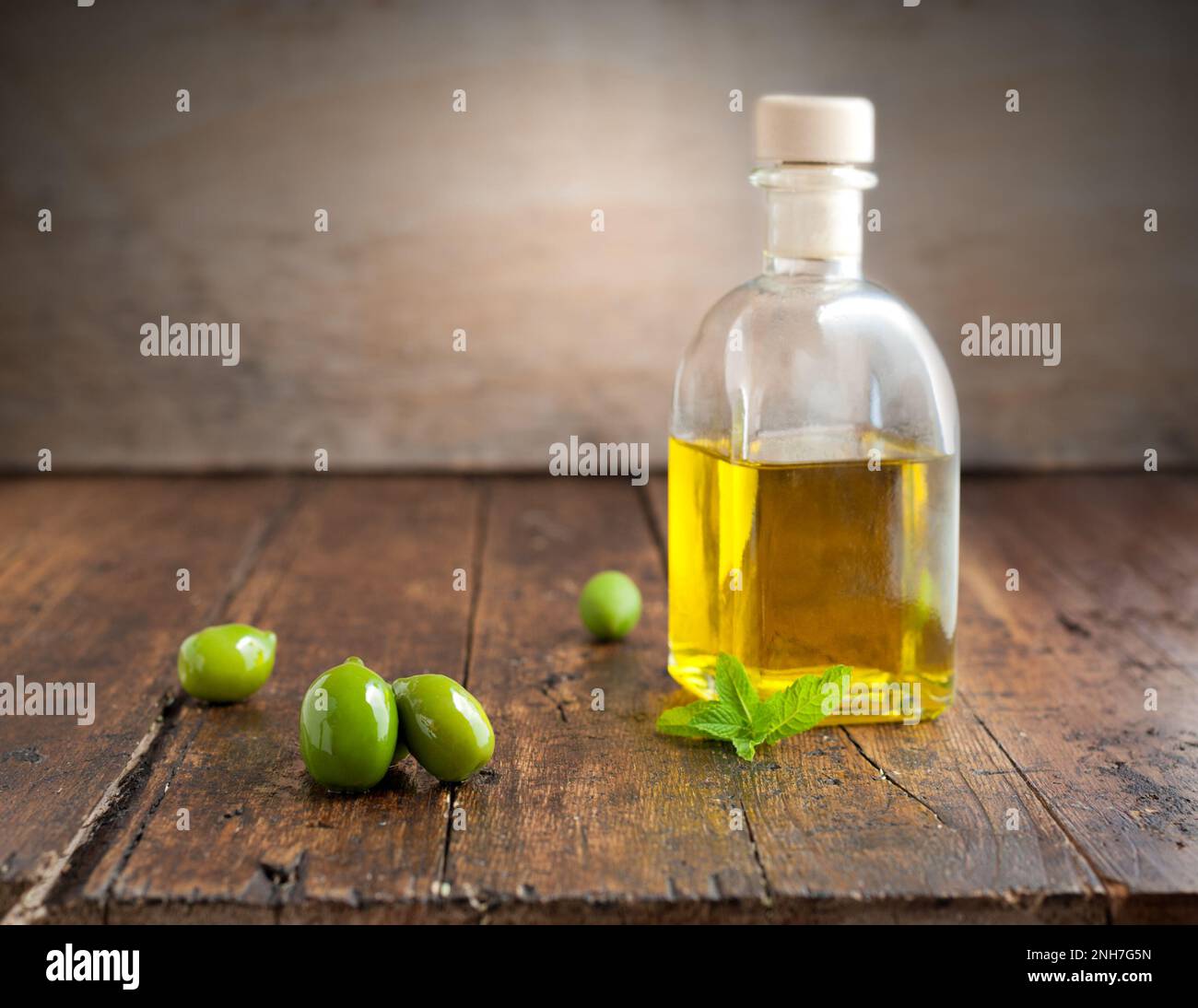 olive oil with several olives on rustic background isolated Stock Photo ...