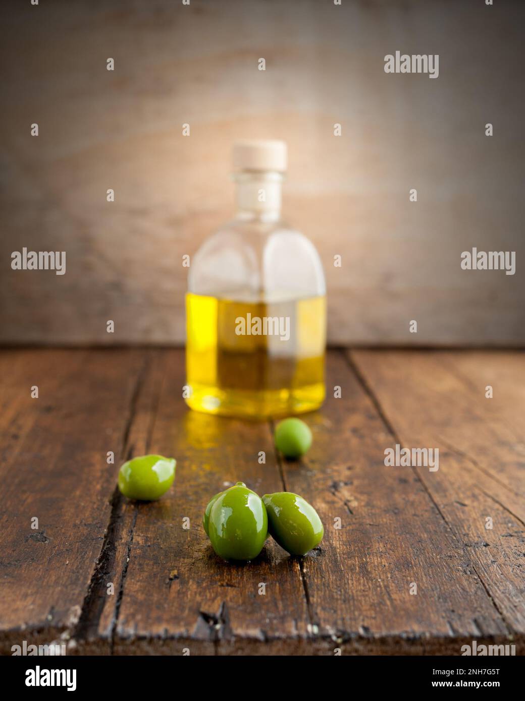 olive oil with several olives on rustic background isolated Stock Photo ...