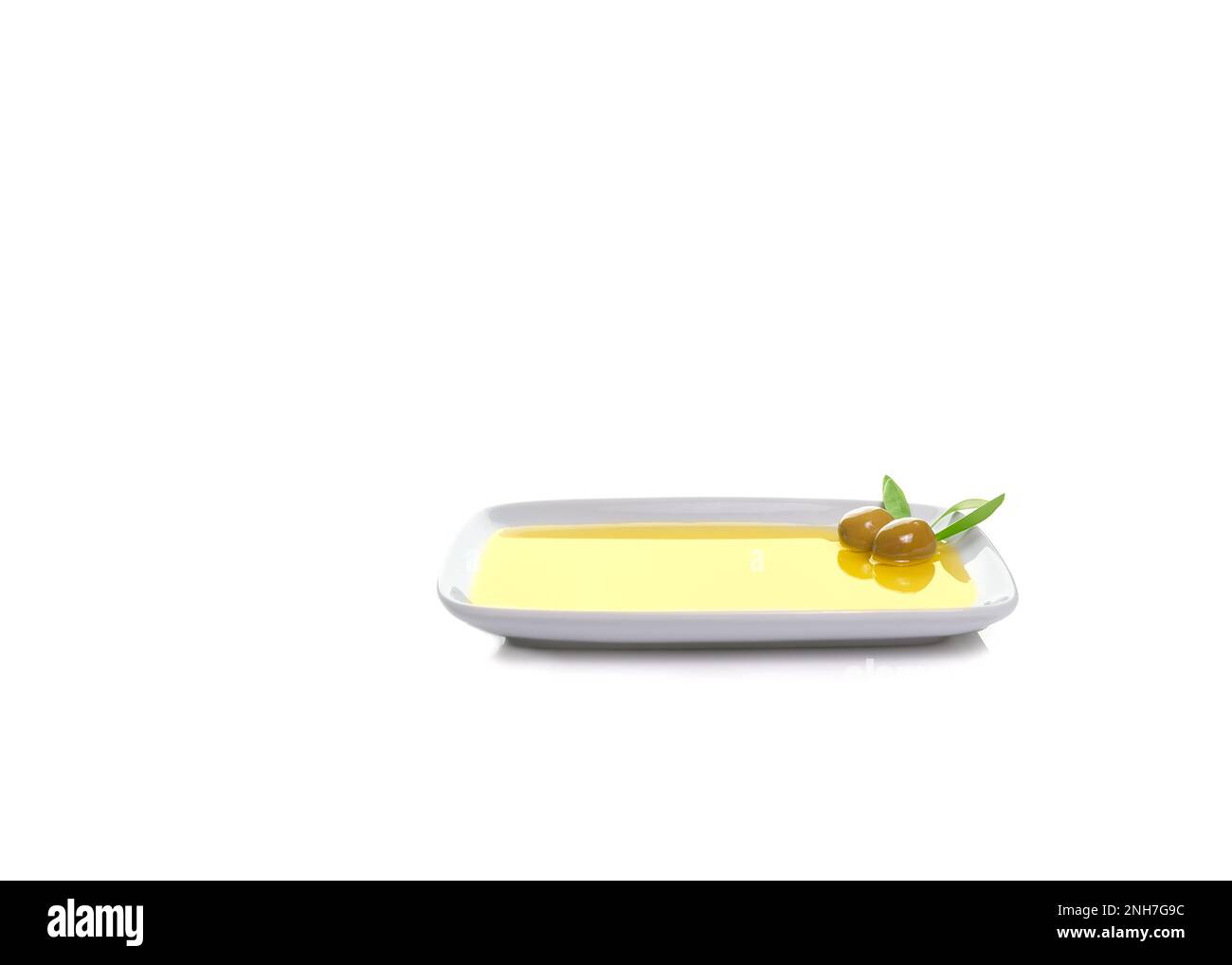 olive oil on plate isolated on white background Stock Photo - Alamy