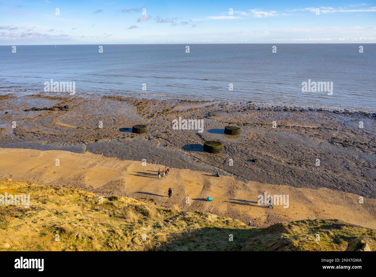 Looking out into the North Sea with the eroding cliffs of Walton on the ...