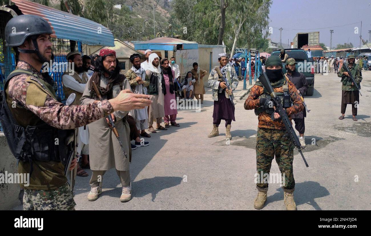 FILE - A Pakistani paramilitary soldier, left, and Taliban fighters ...