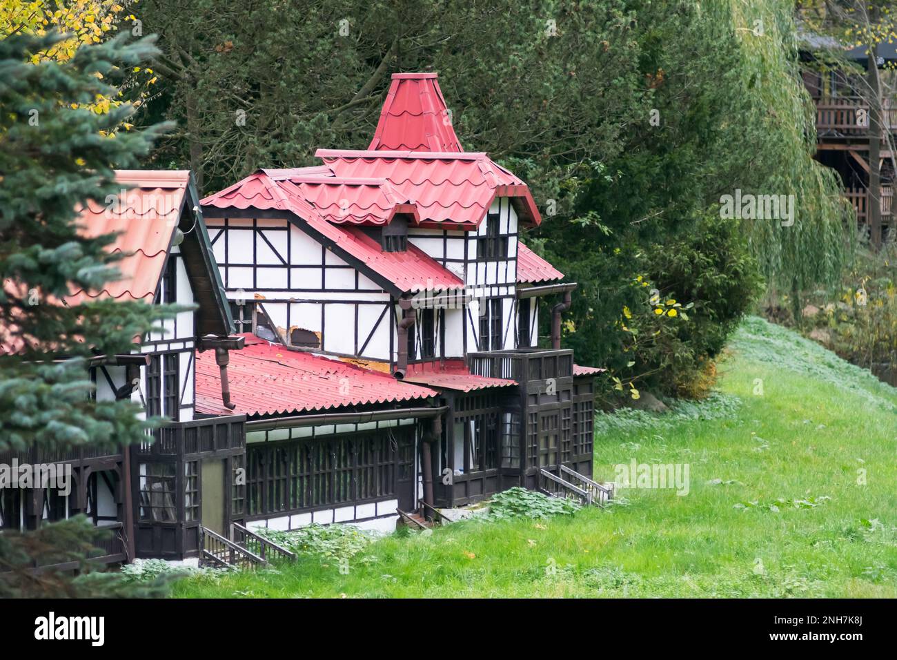 German style miniature house on green grass Stock Photo - Alamy