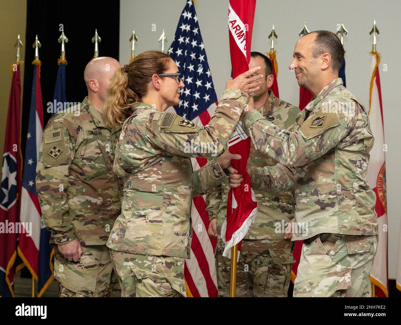 U.S. Army Lt. Col. Peter M. Ammerman, outgoing commander, passes the ...