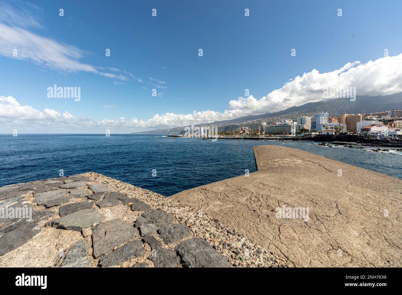 Warm sunshine palliative view from Puerto de la Cruz harbour across the ...