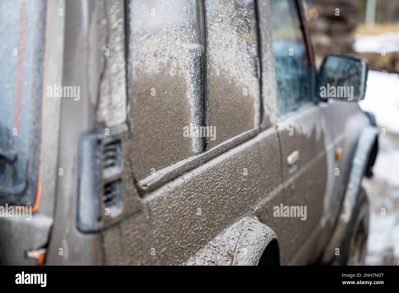 Mad splattered 4x4 SUV. Dirty car side. Splash and texture of mud on a ...