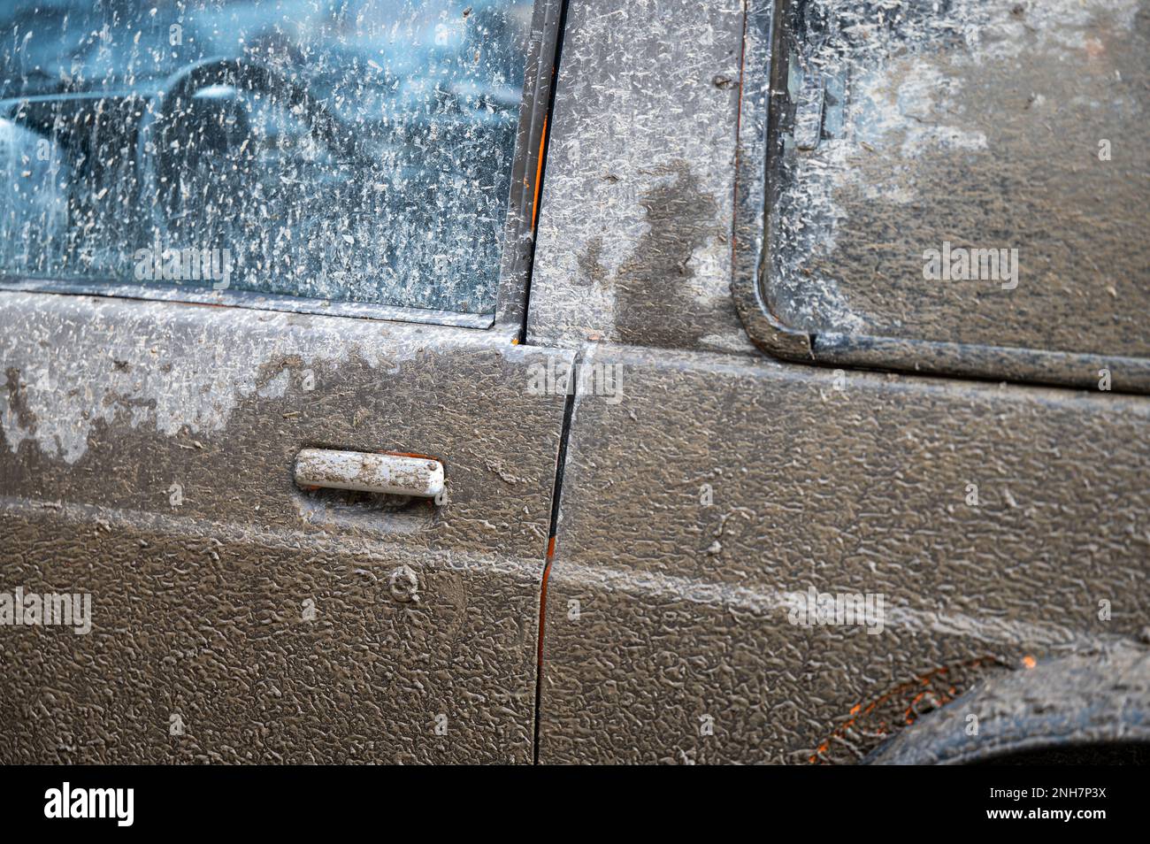 Mad splattered 4x4 SUV. Dirty car side. Splash and texture of mud on a ...
