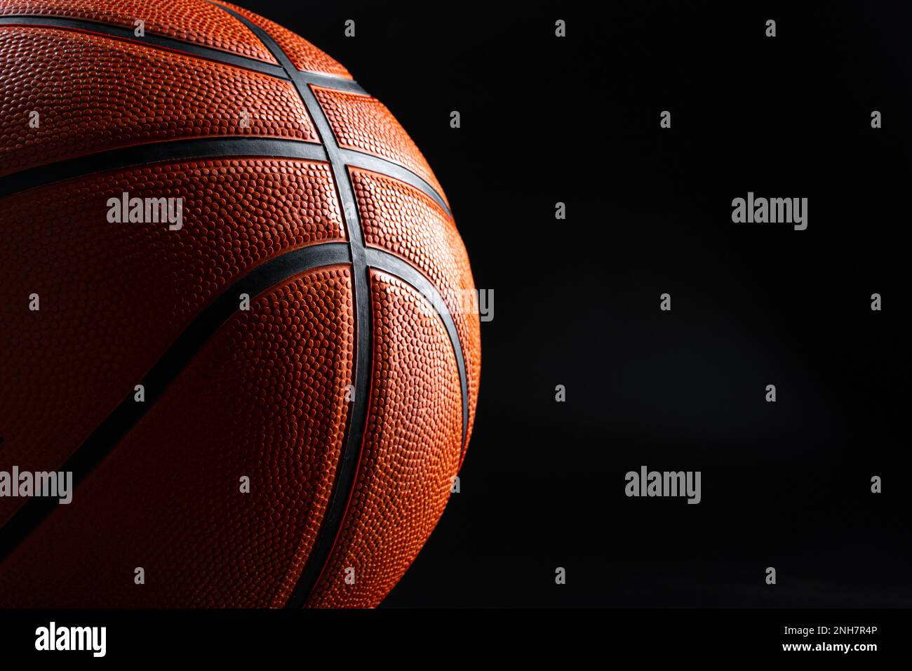 Basketball ball close up on dark black background Stock Photo - Alamy