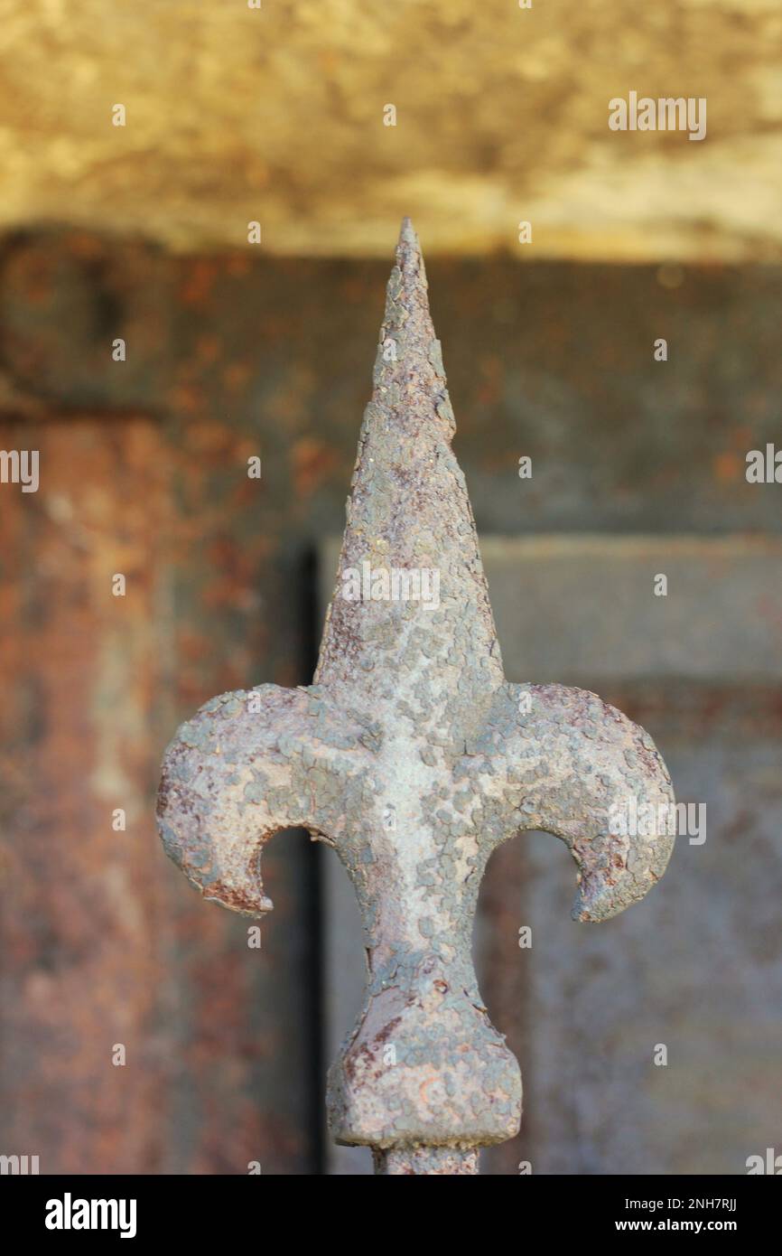 A sharp pointy and rusty decoration on an old vintage fence Stock Photo ...