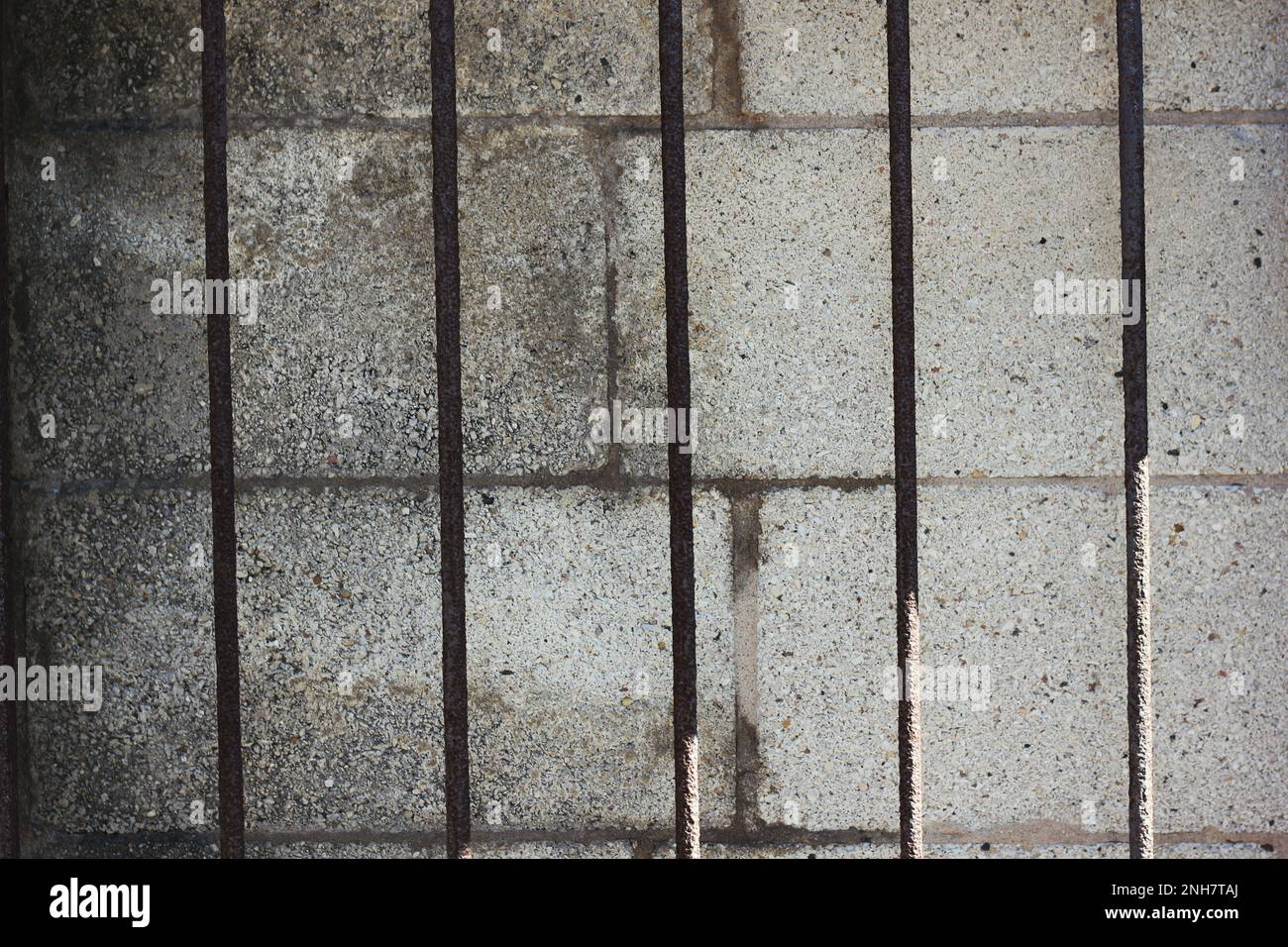 Old rusty prison bars with a brick wall Stock Photo - Alamy