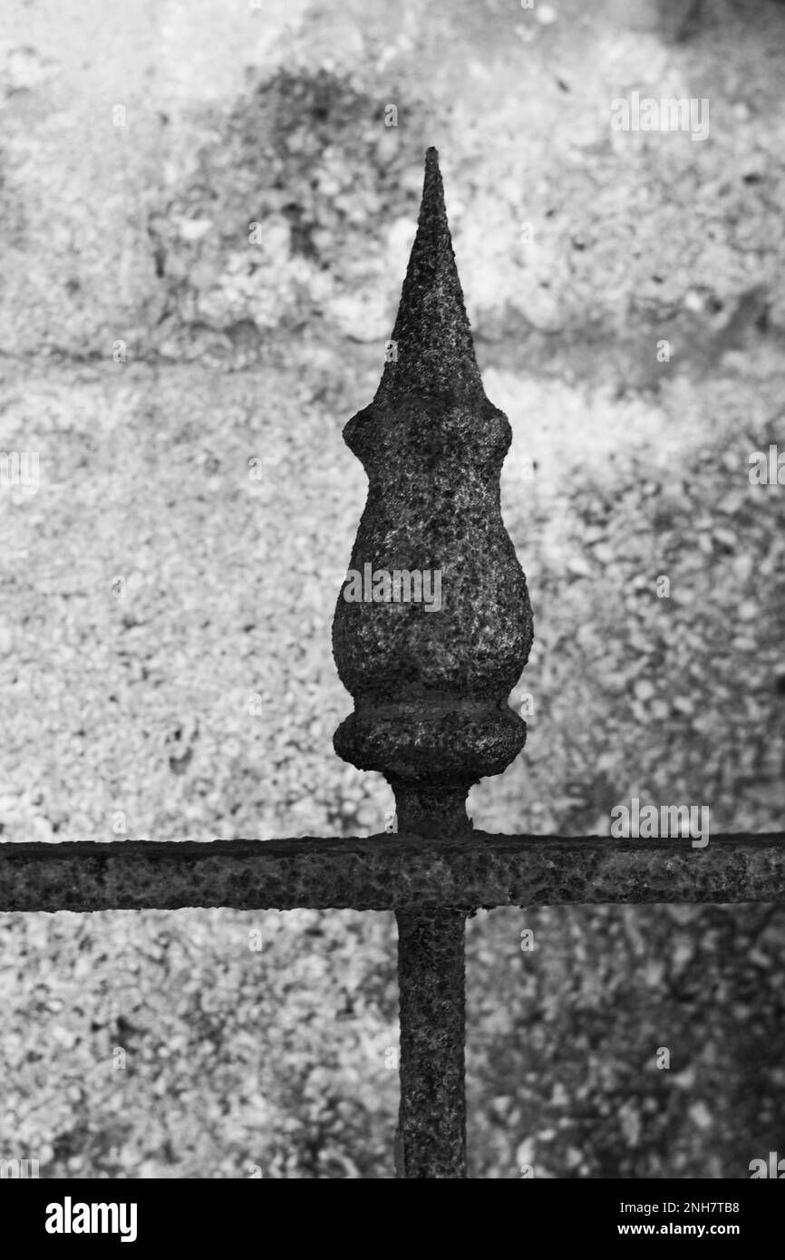 A closeup of a pointy and sharp decoration on an old medieval fence in ...