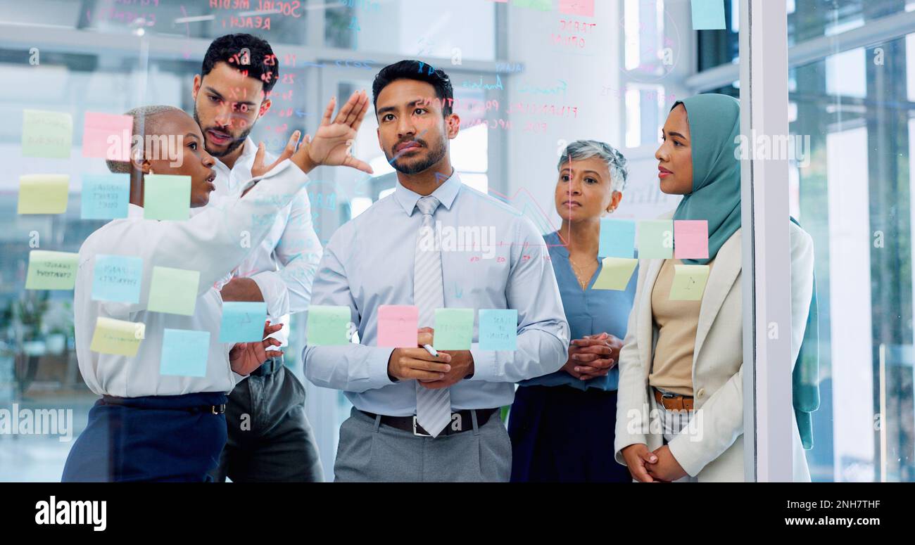 Meeting, collaboration and sticky notes with a business man training a ...