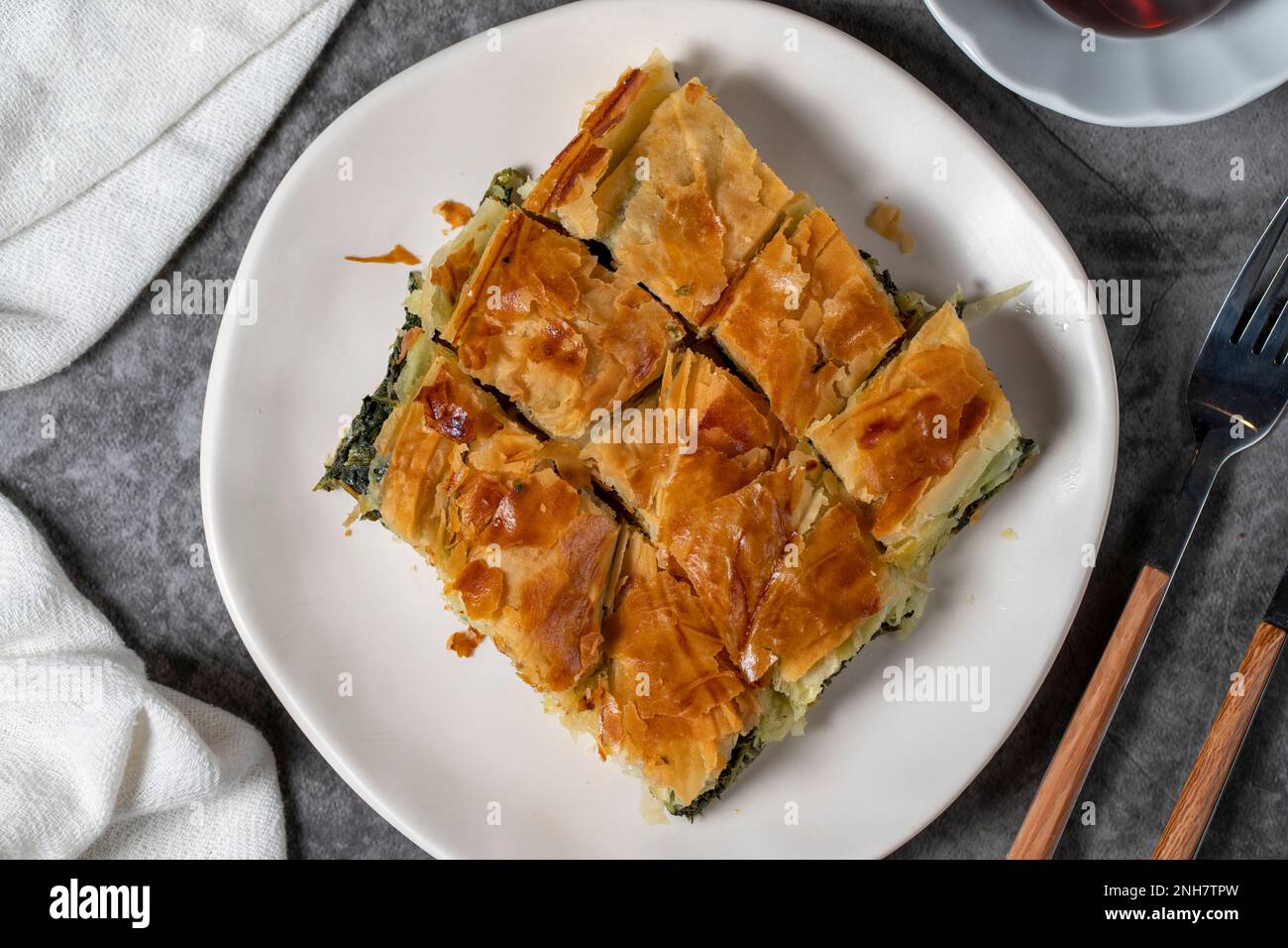 Spinach pastry. Traditional Turkish cuisine delicacies. Spinach pie ...