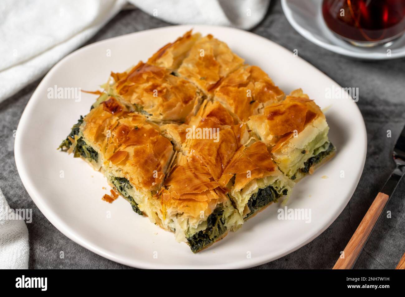 Spinach pastry. Traditional Turkish cuisine delicacies. Spinach pie ...